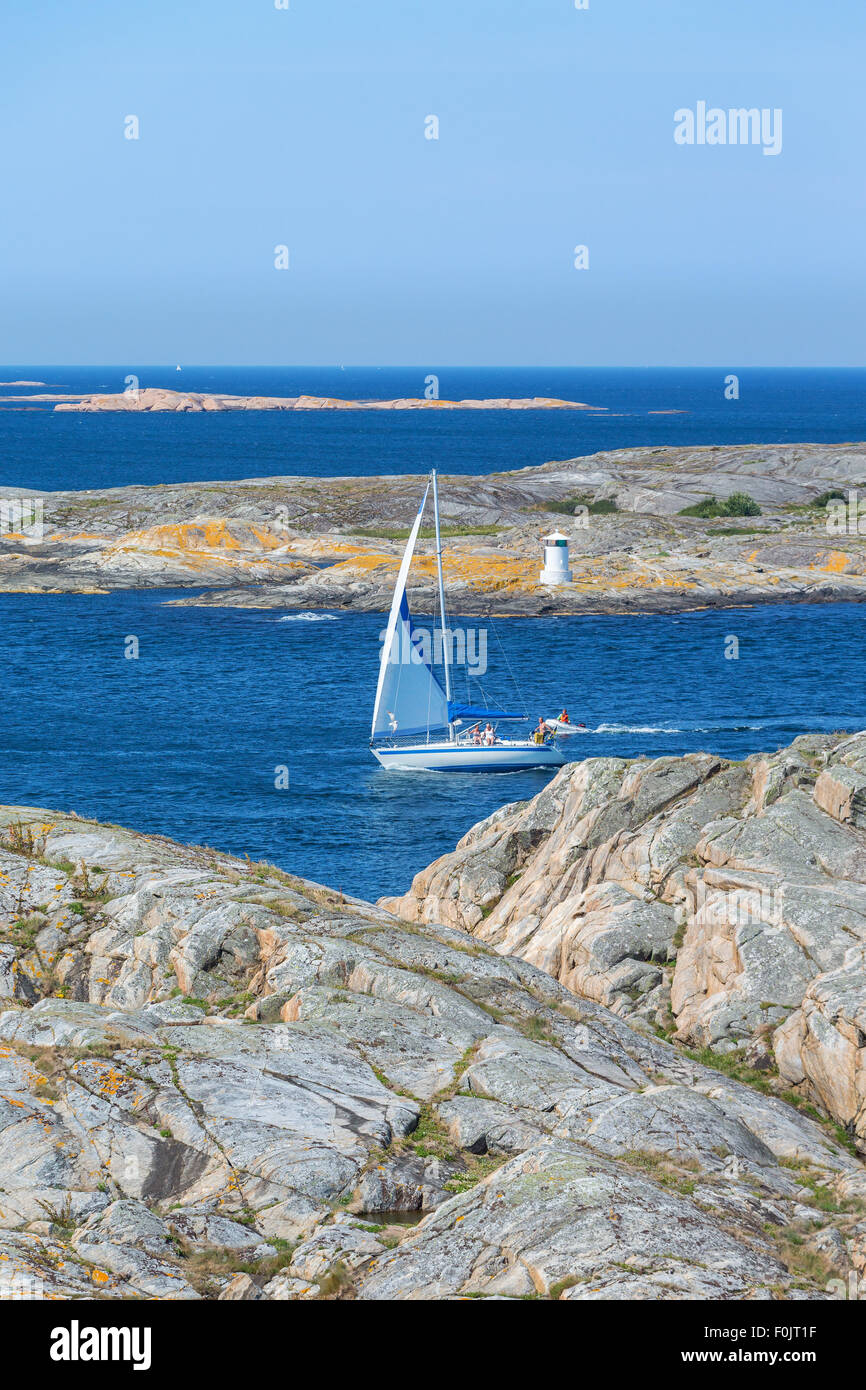 Sailboat sailing among the rocks in the sea archipelago Stock Photo - Alamy