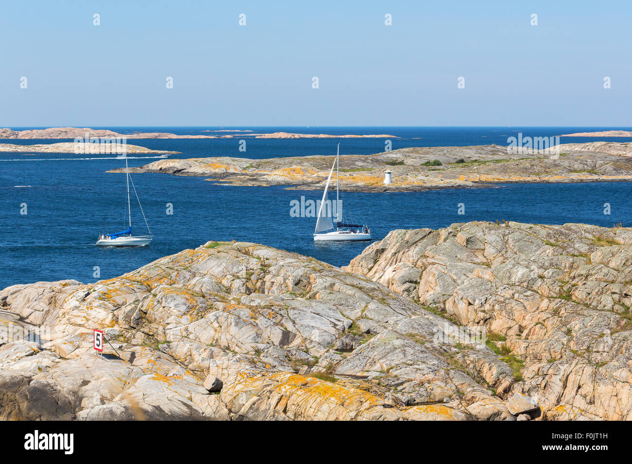Sailboats sailing among the rocks in the sea archipelago on the Swedish ...