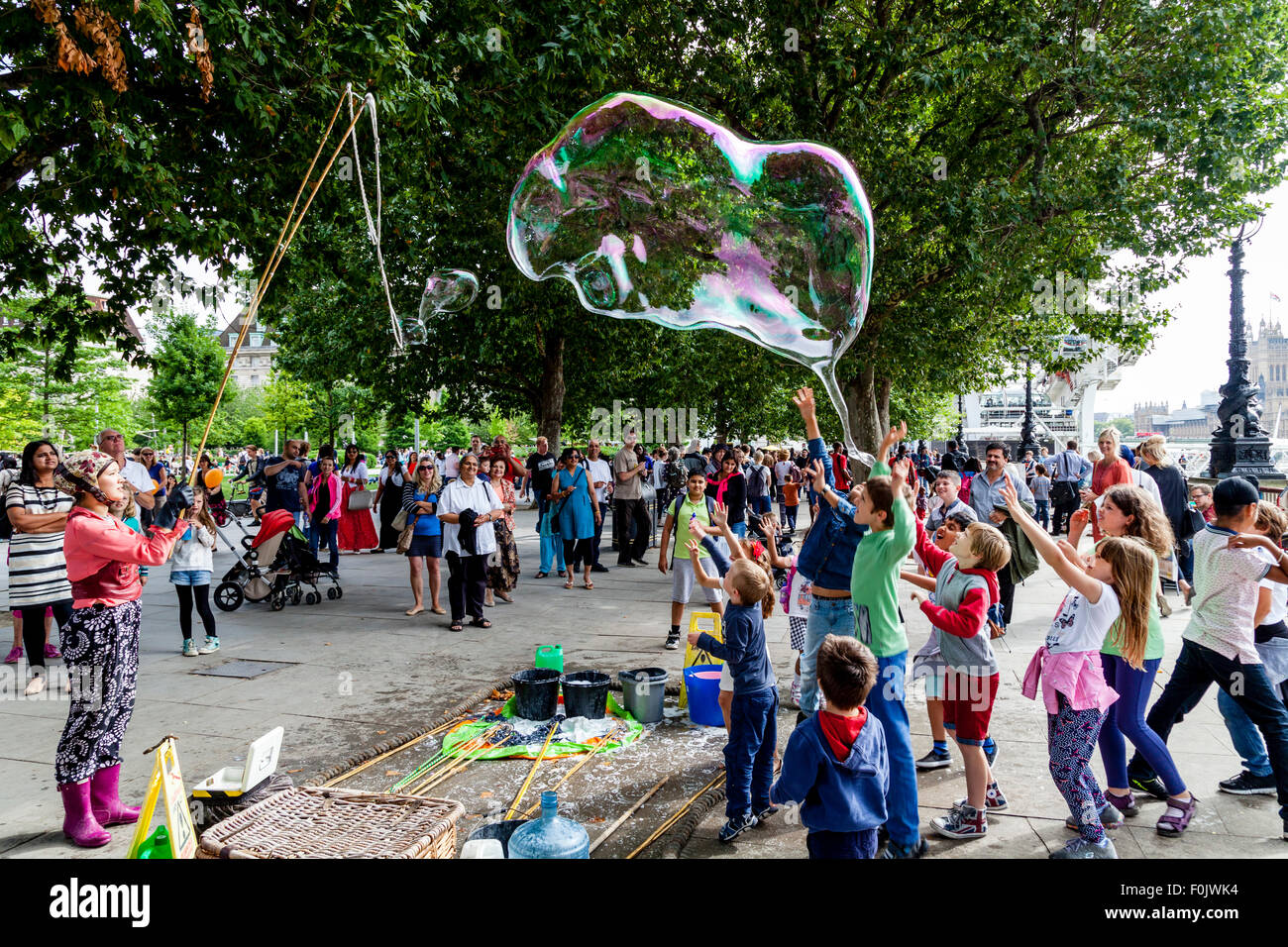 A Street Entertainer and Her Bubble Show, The Southbank, London ...