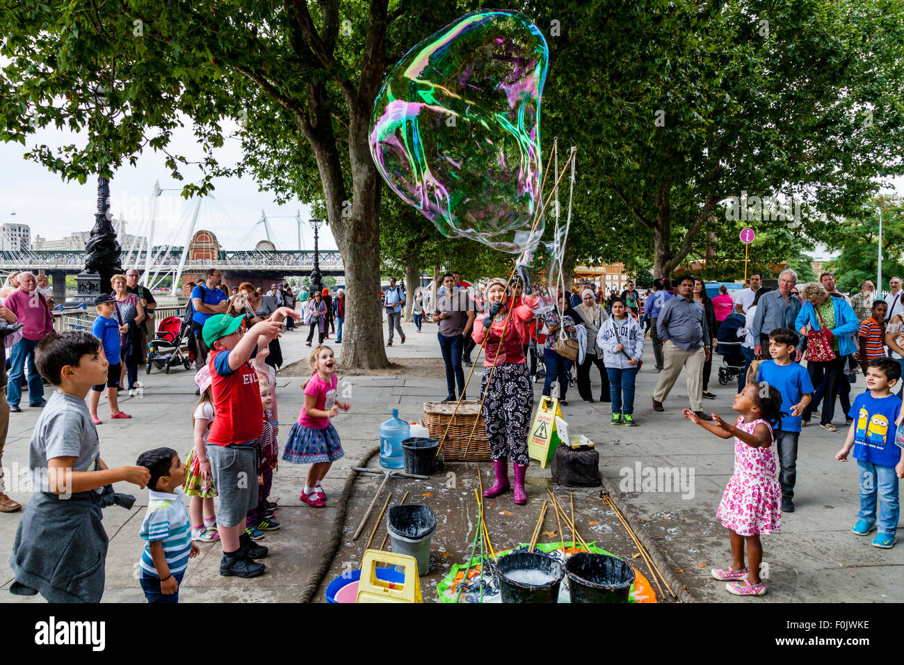 A Street Entertainer and Her Bubble Show, The Southbank, London ...