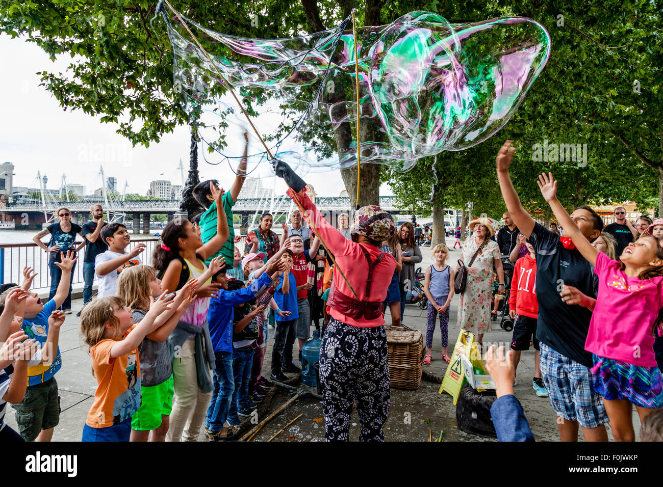 A Street Entertainer and Her Bubble Show, The Southbank, London ...