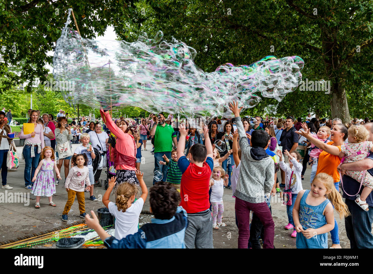 A Street Entertainer and Her Bubble Show, The Southbank, London ...