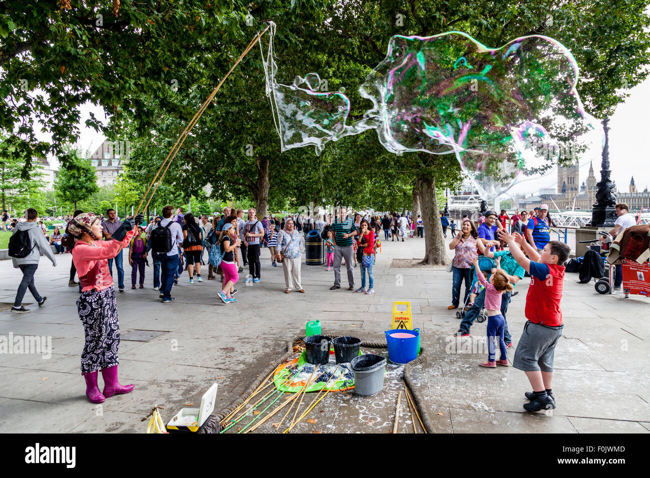 A Street Entertainer and Her Bubble Show, The Southbank, London ...