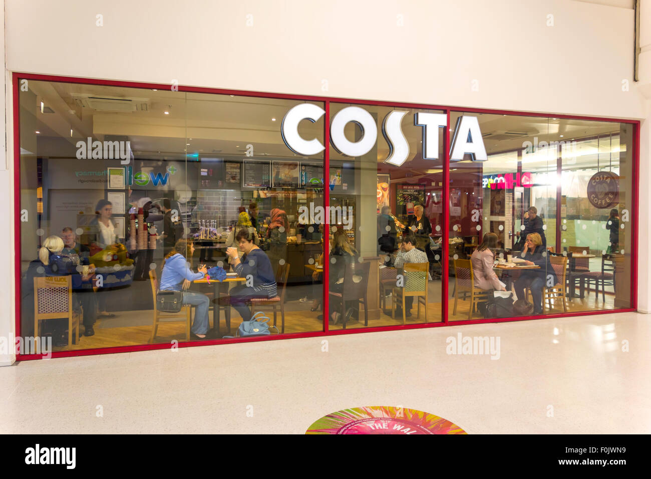 People having coffee in a branch of Costa a café chain owned by ...