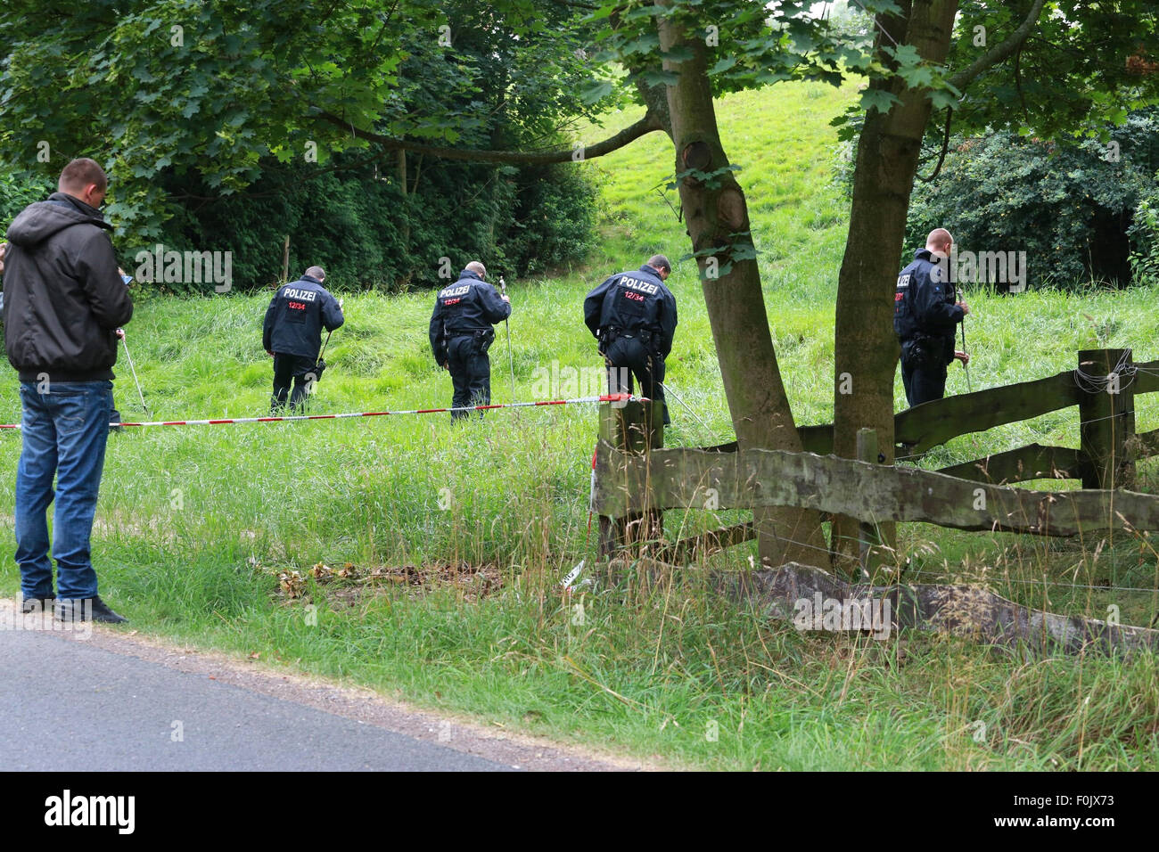 Meissen, Germany. 17th Aug, 2015. Police officers sweep the area as ...