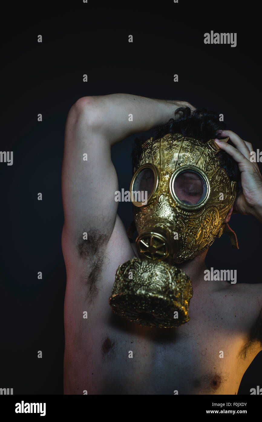 depression and danger man with golden gas mask Stock Photo - Alamy