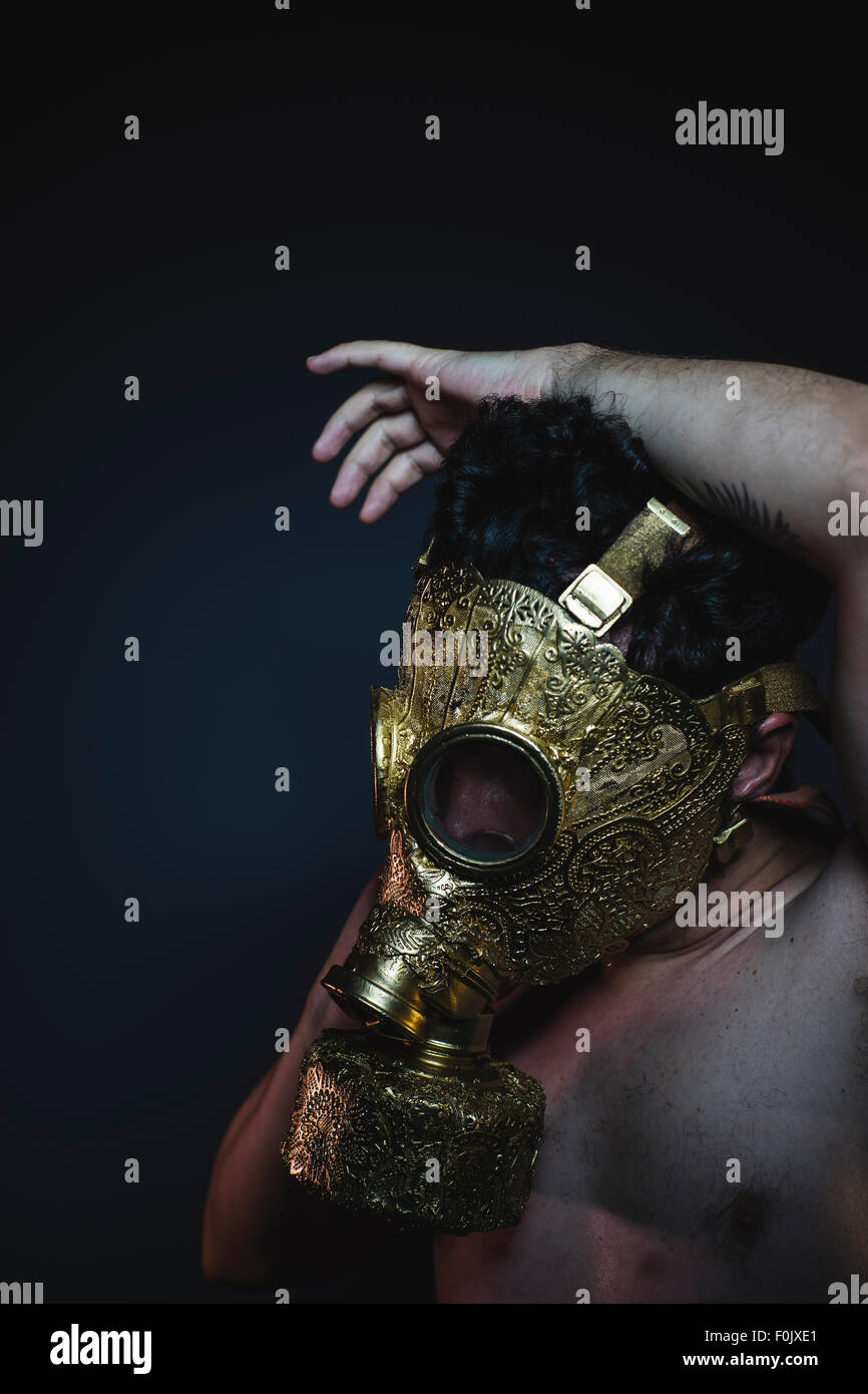 armageddon, depression and danger man with golden gas mask Stock Photo ...