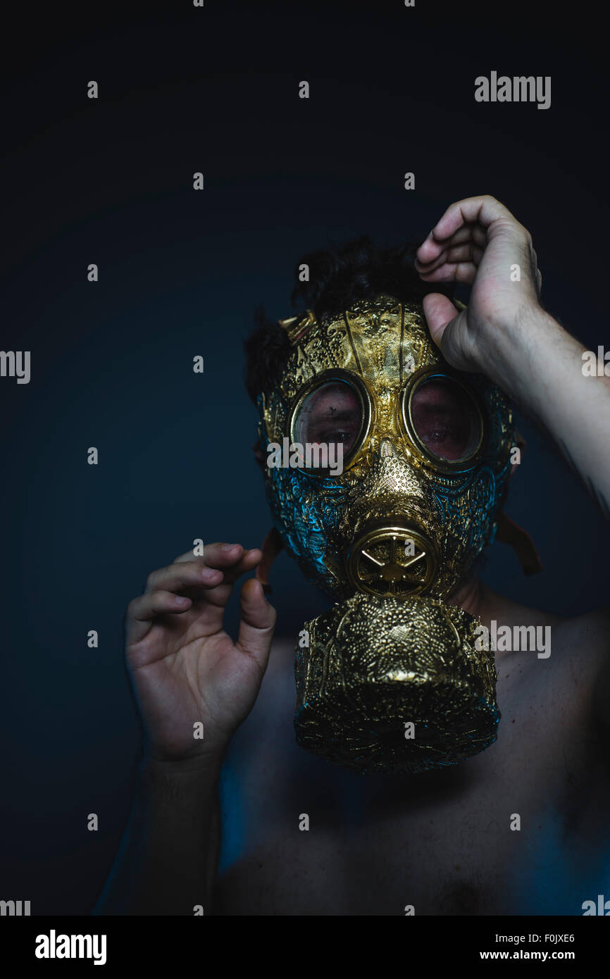 military, depression and danger man with golden gas mask Stock Photo ...