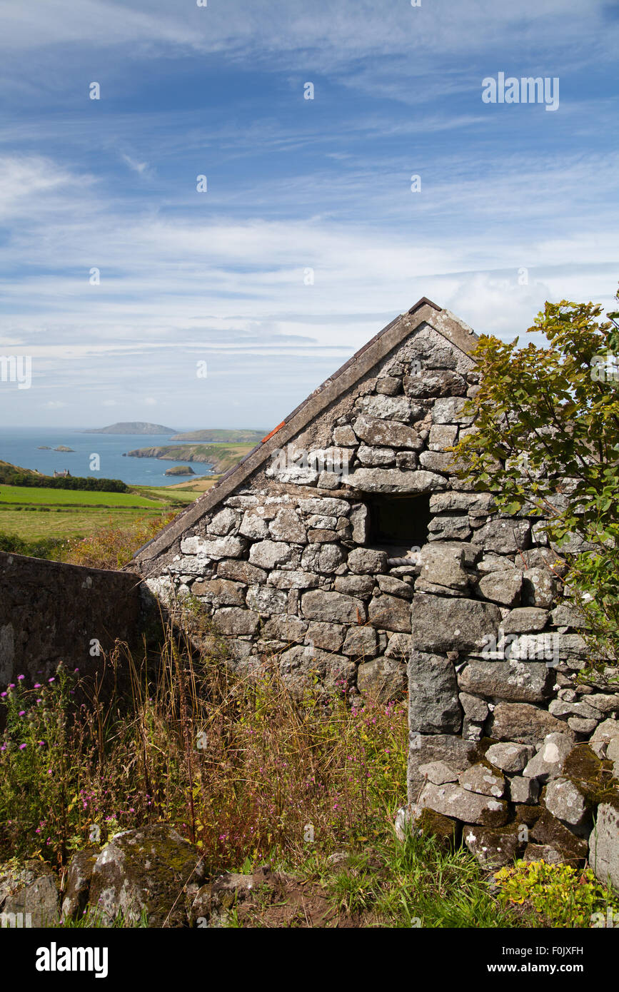 Stone outbuilding with a view across fields towards Ynys Enlli and Pen ...