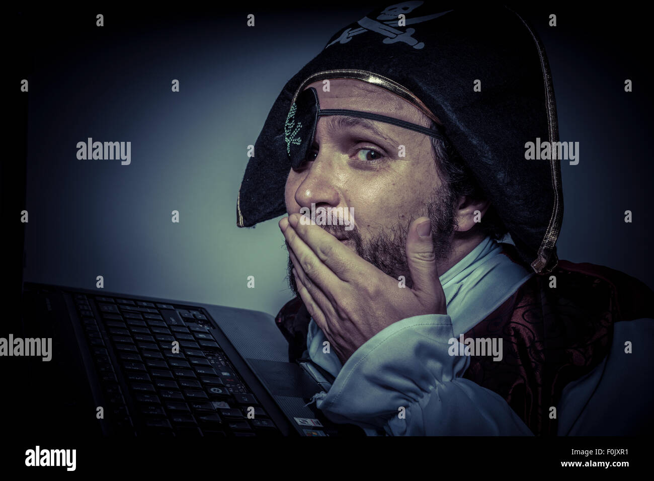 Stealing, computer security, hacker pirate dress with hat and skull ...