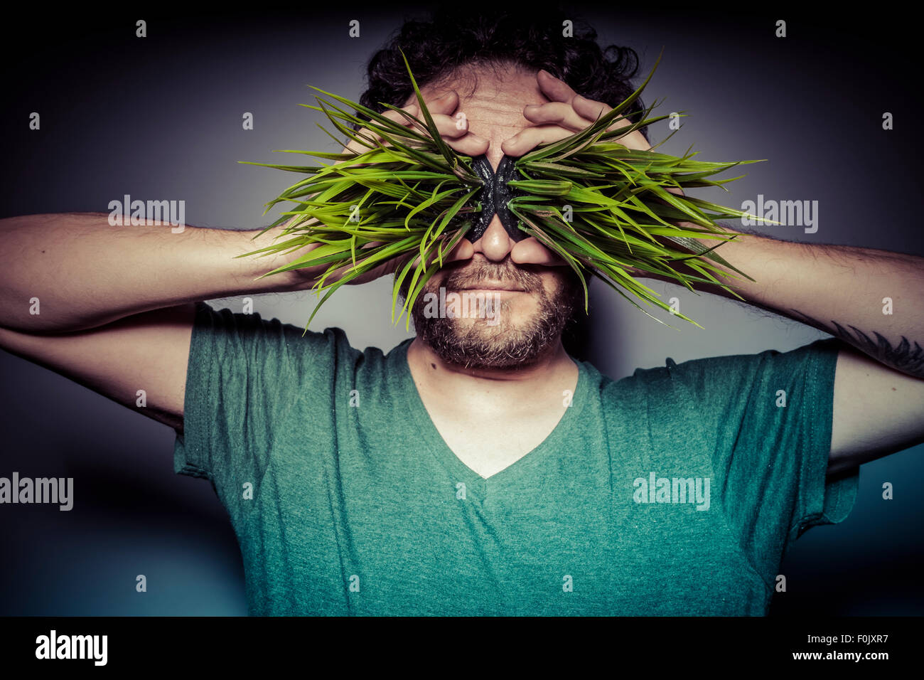 Relaxing, vegetarian concept, man with green grass in the mouth Stock ...