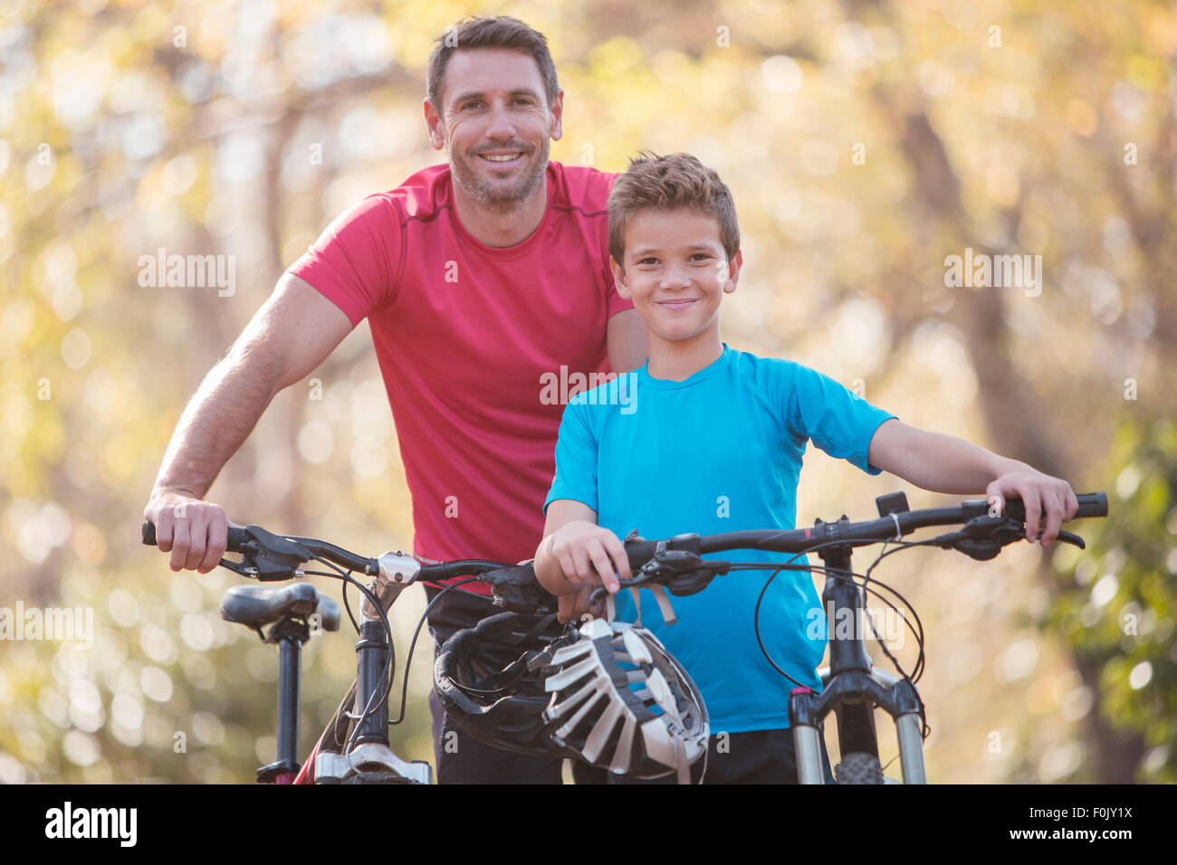 Boy standing riding bike hi-res stock photography and images - Alamy