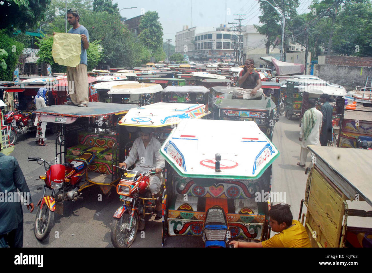 Ching-Chi Motorcycle rickshaw drivers and owners chant slogans against ...