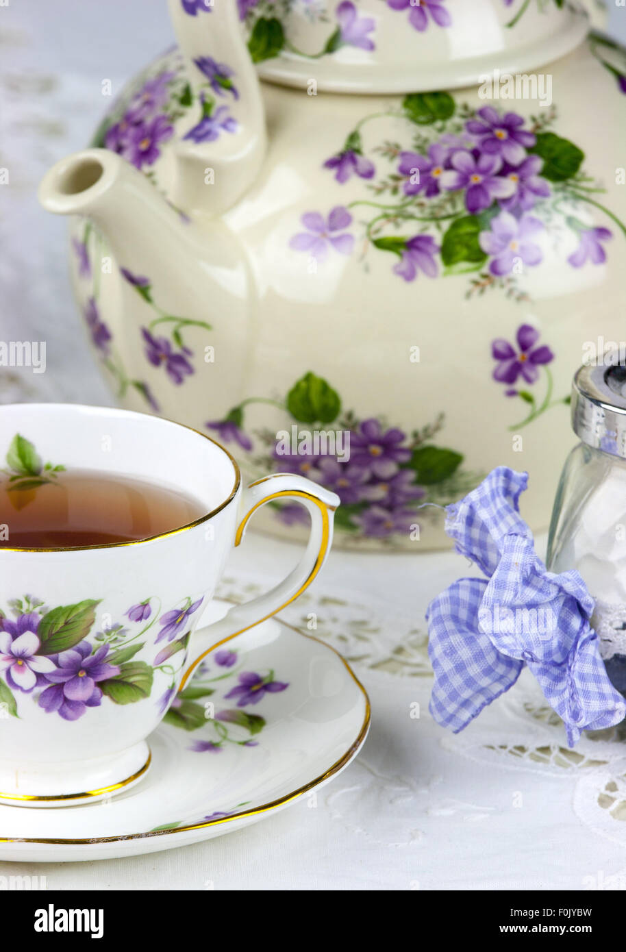 English afternoon tea with sweet and candied violets Stock Photo - Alamy