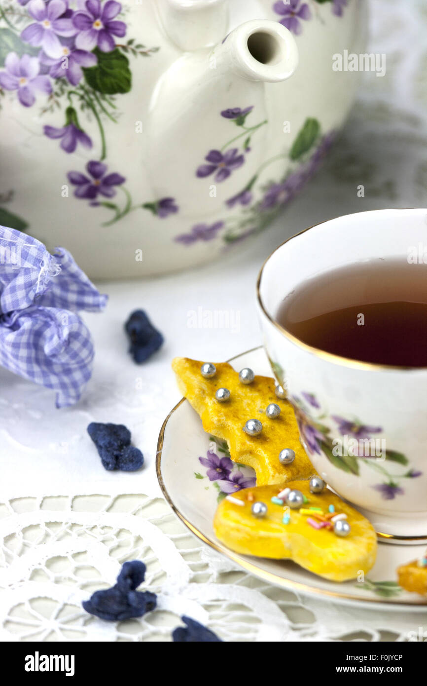 English afternoon tea with cookies and candied violets Stock Photo - Alamy