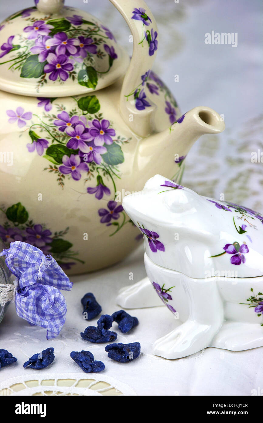 English afternoon tea with sweet and candied violets Stock Photo - Alamy