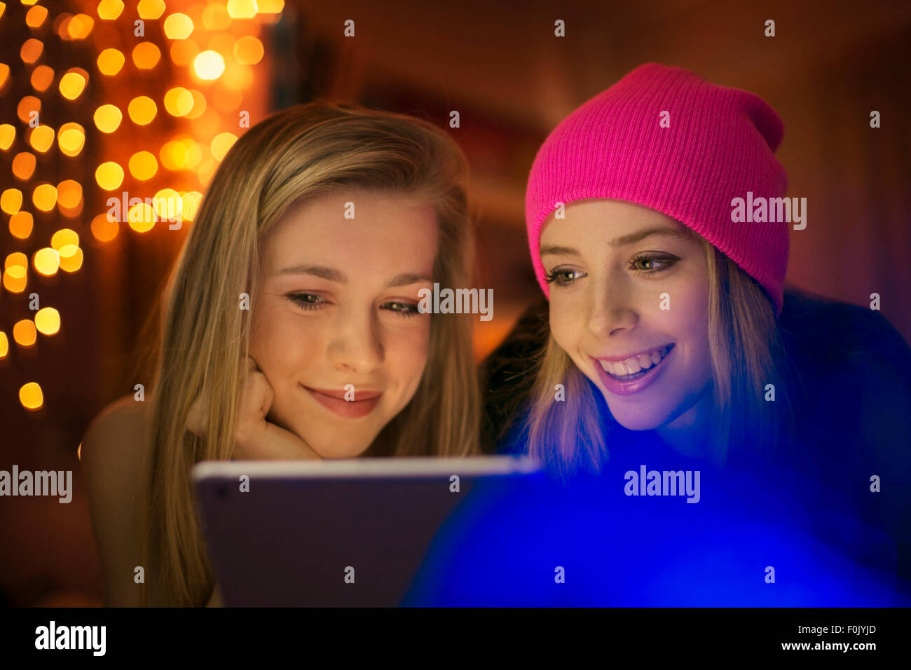 Teenage girls using digital tablet Stock Photo - Alamy