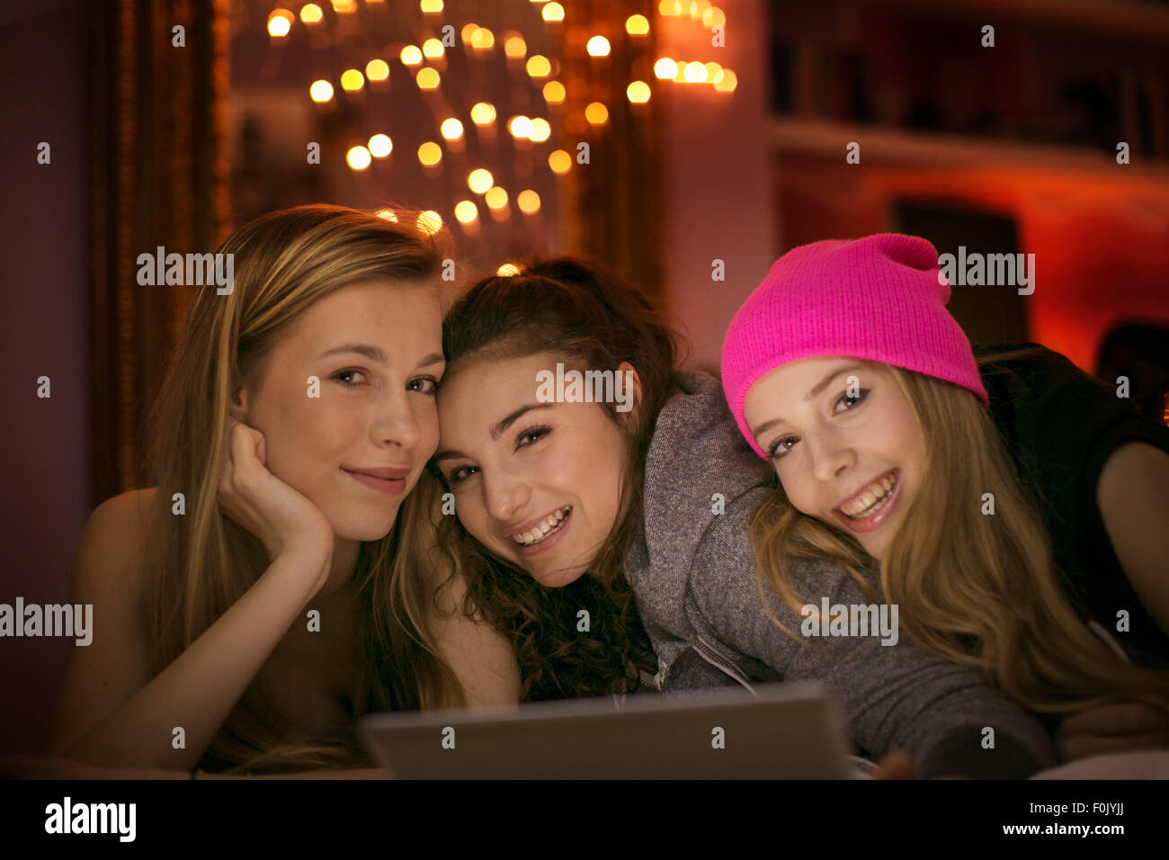 Portrait smiling teenage girls using digital tablet Stock Photo - Alamy