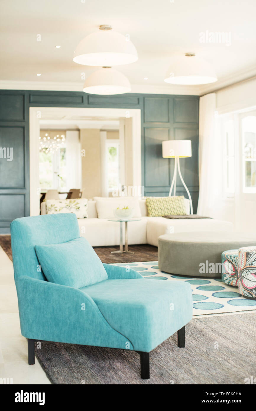 Turquoise armchair in luxury living room Stock Photo - Alamy