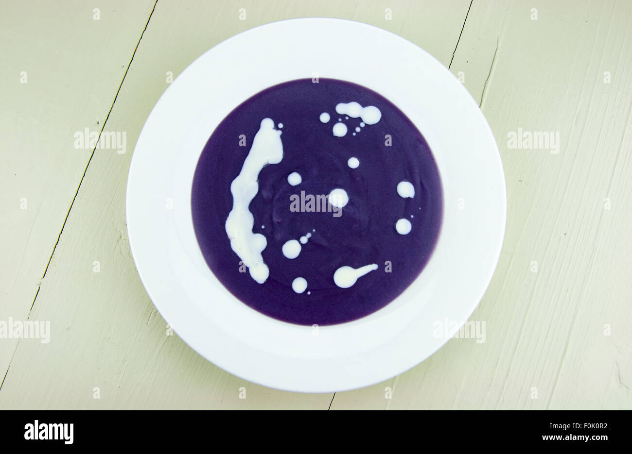 Violet potato and leek soup with cream Stock Photo - Alamy