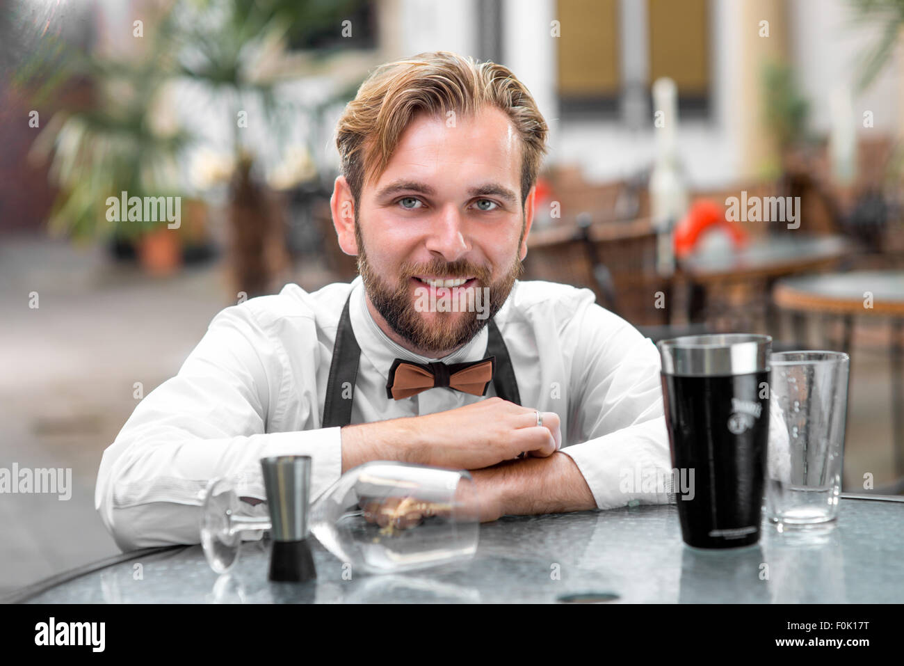 Portrait of barman at the restaurant Stock Photo - Alamy