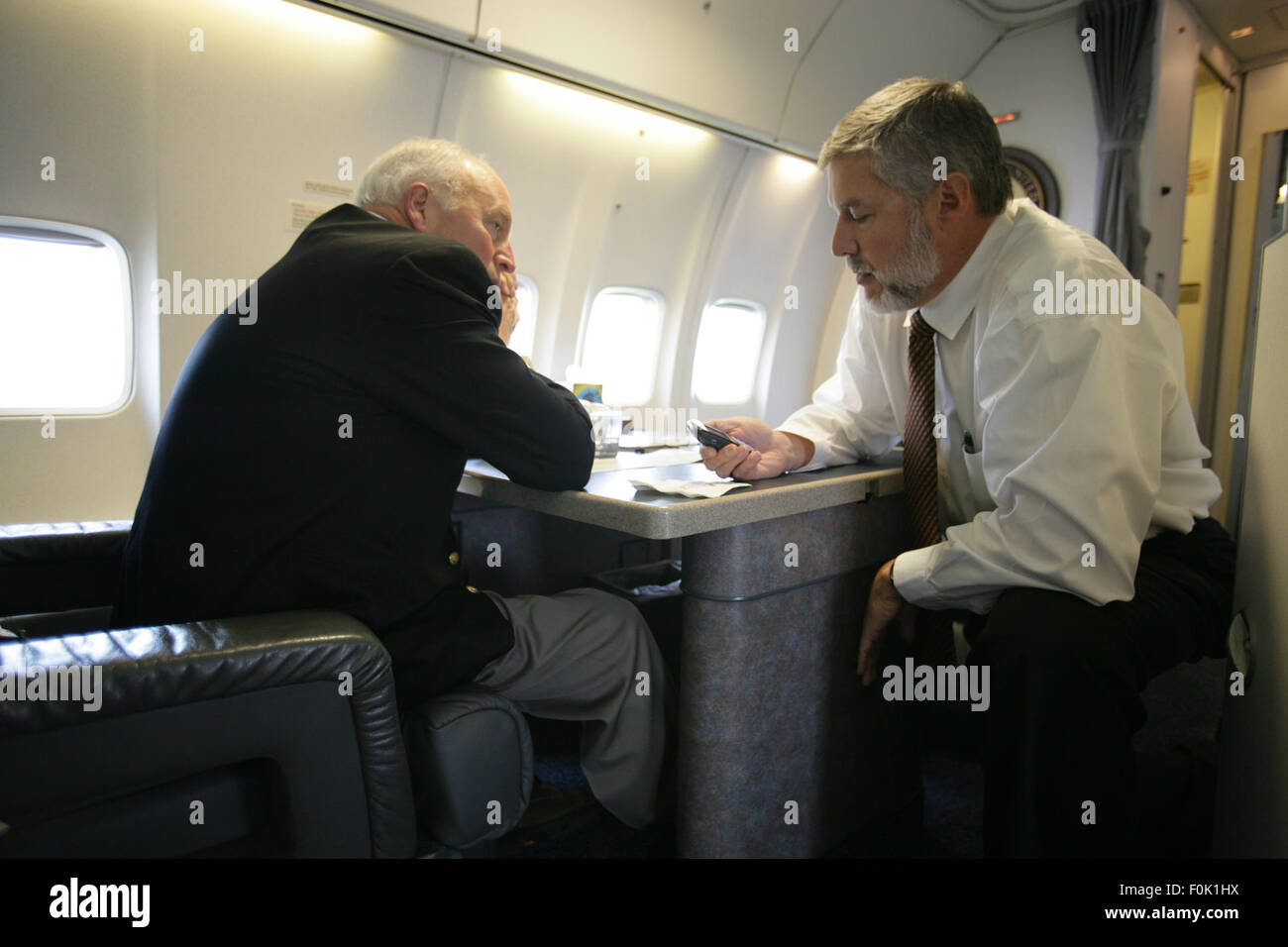 Vice President Cheney Talks with David Addington Aboard Air Force Stock ...
