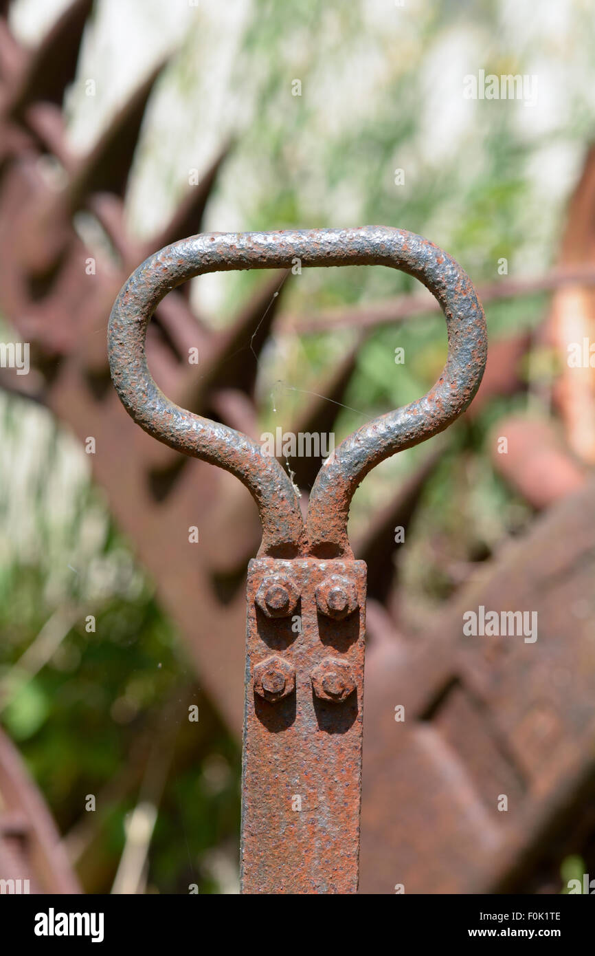 Rusted metal farm plough handle on farm in French countryside Stock ...