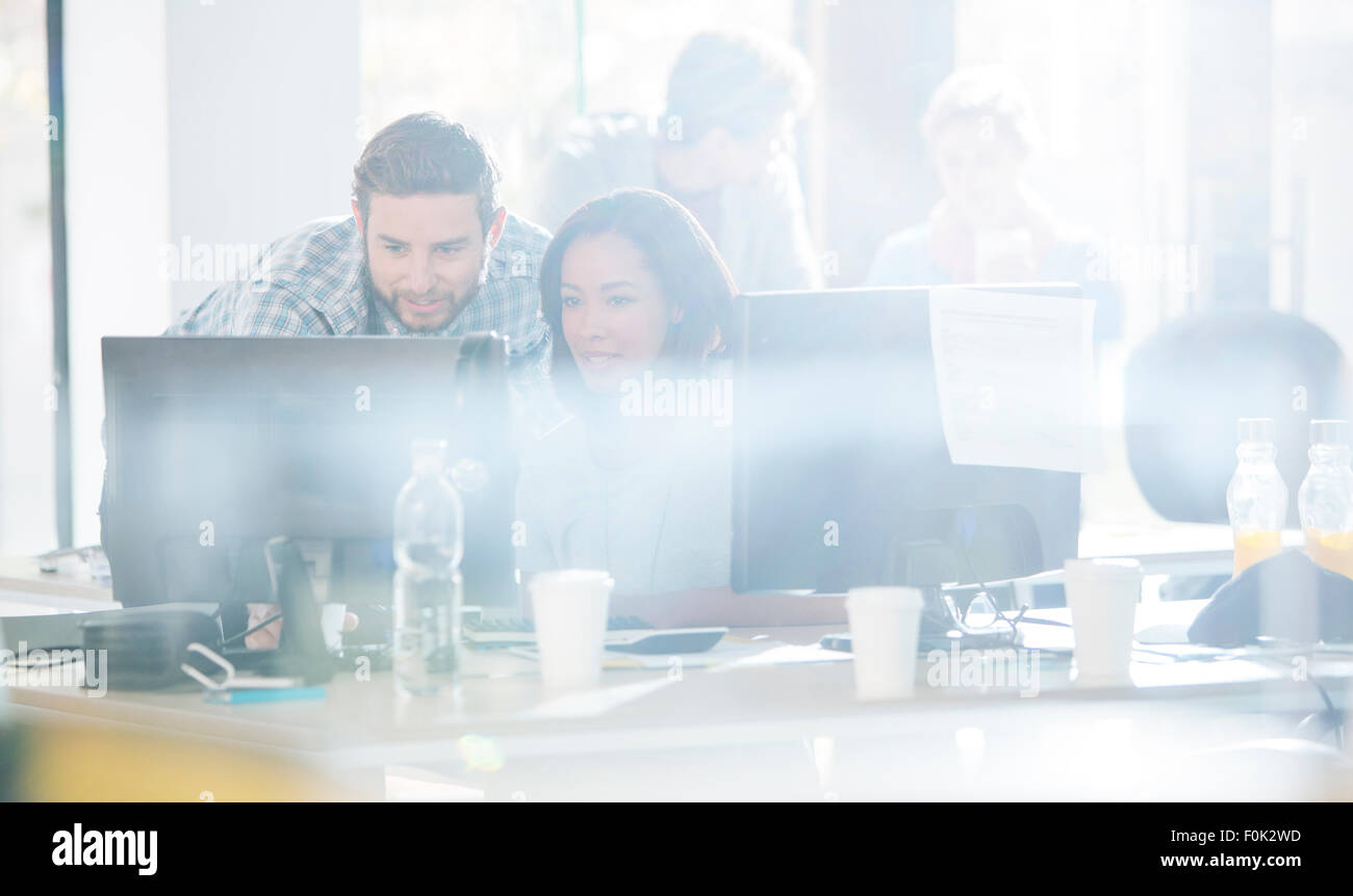 Business people using computer in sunny office Stock Photo - Alamy
