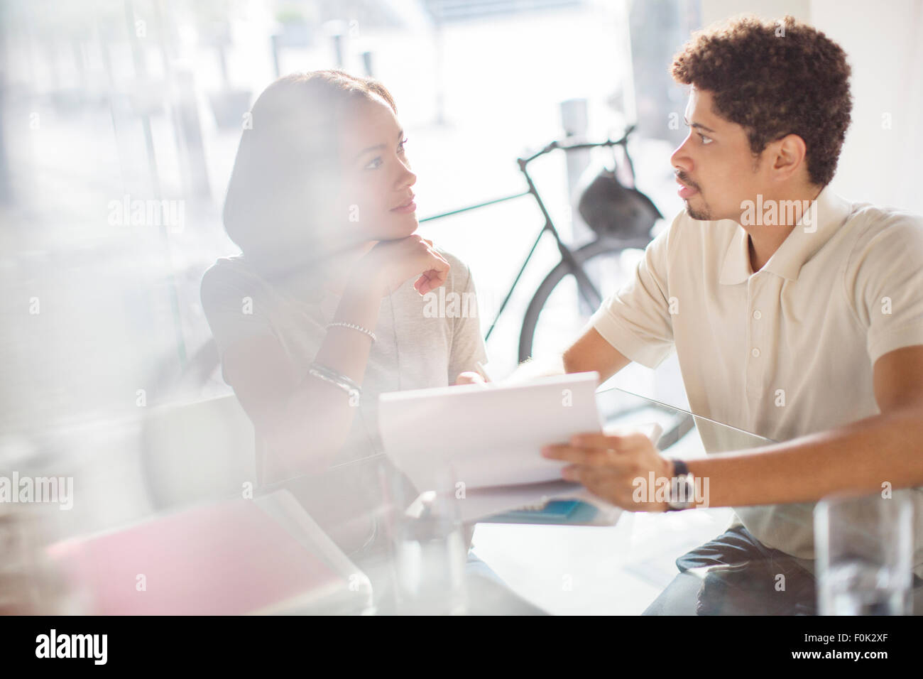 Creative business people reviewing paperwork in office Stock Photo - Alamy Creative business people reviewing paperwork in office Stock Photo - Alamy