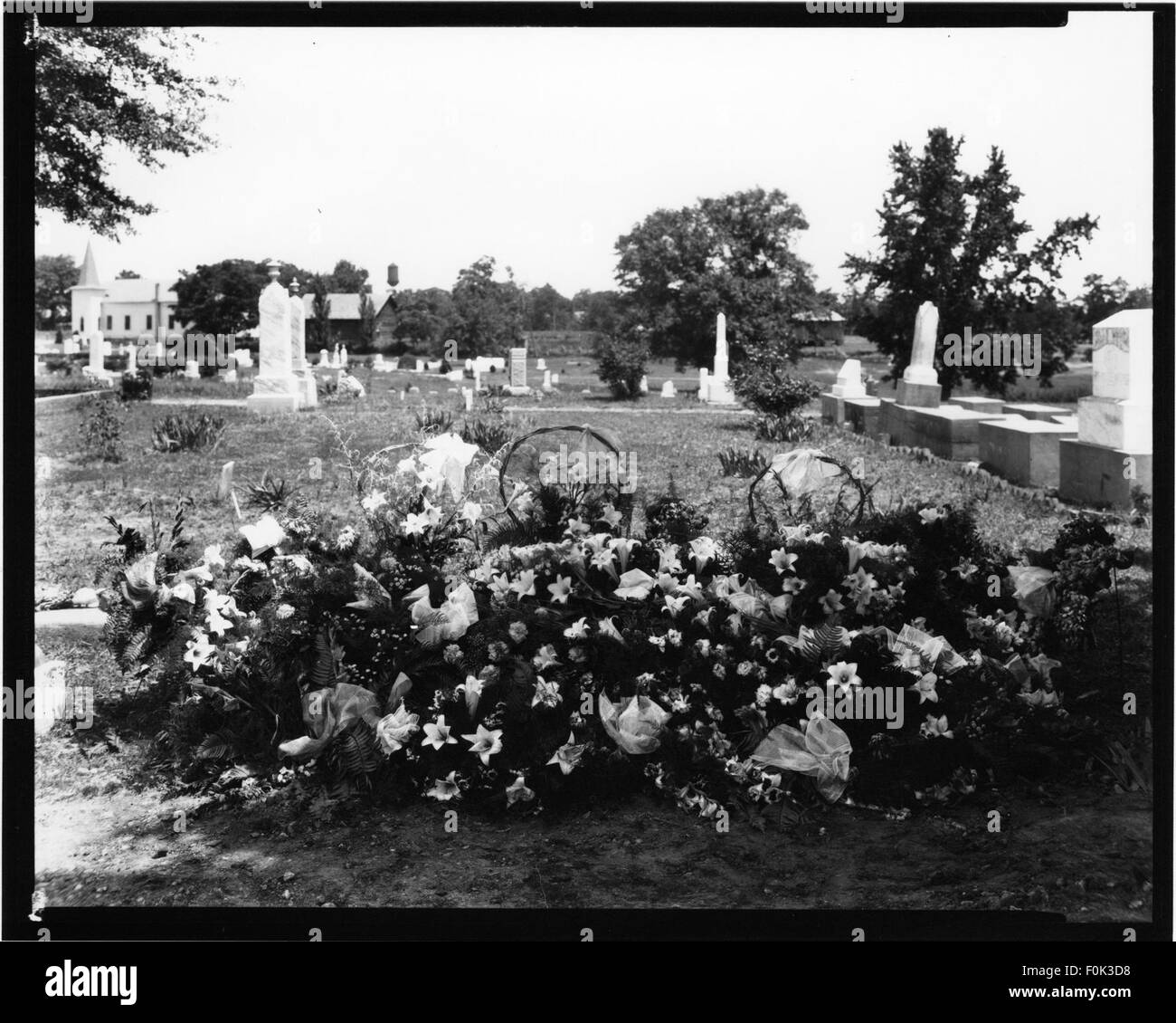 The funeral gravesite, located in a cemetery, marks the final resting ...