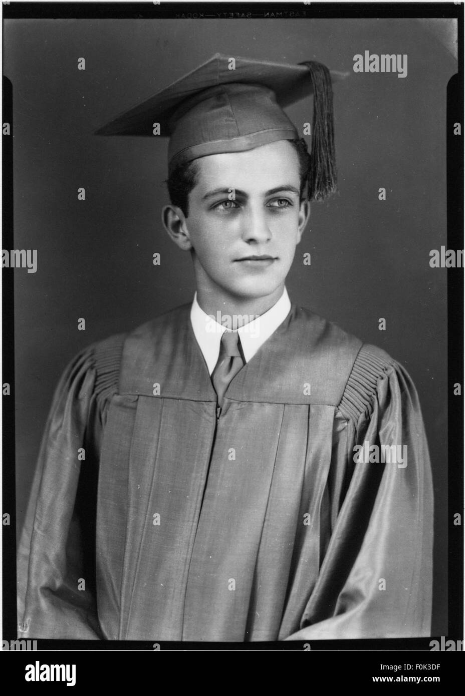 This graduation portrait captures an individual at the significant ...