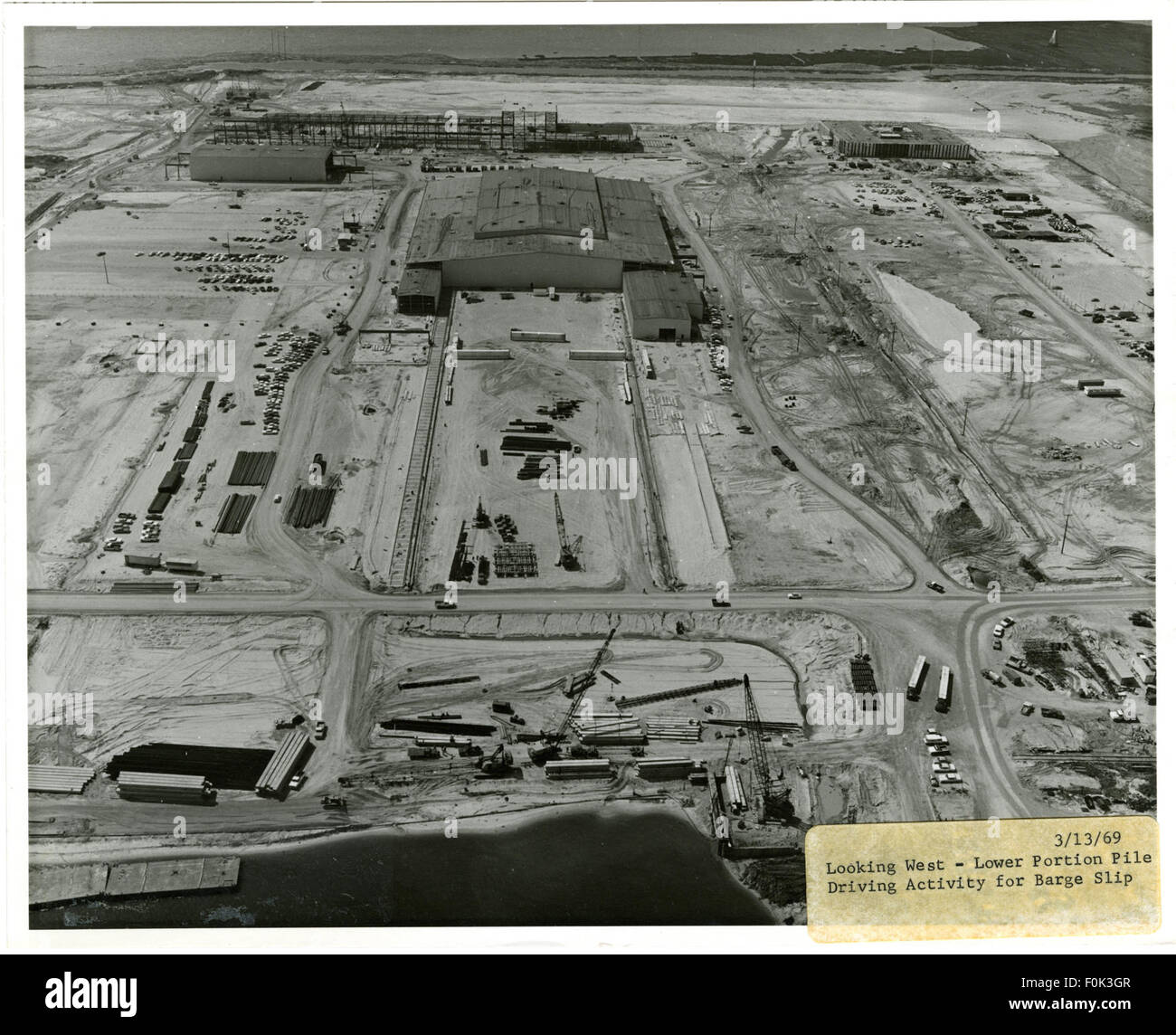 An aerial view shows pile driving activity for a barge in the lower ...