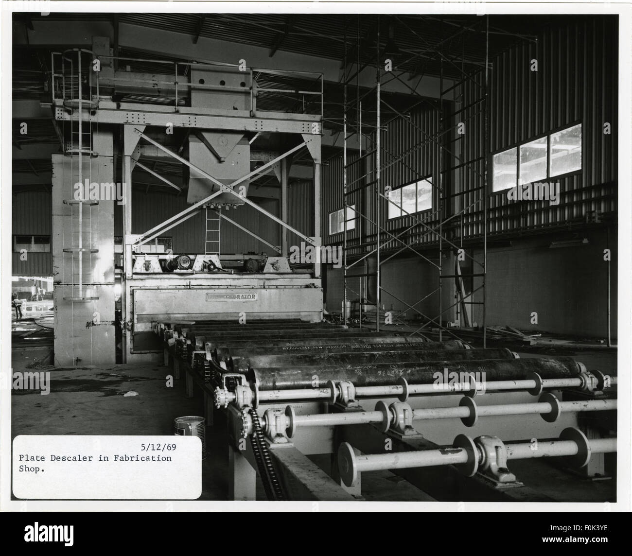 A plate descaler used in a fabrication shop, typically for cleaning and ...