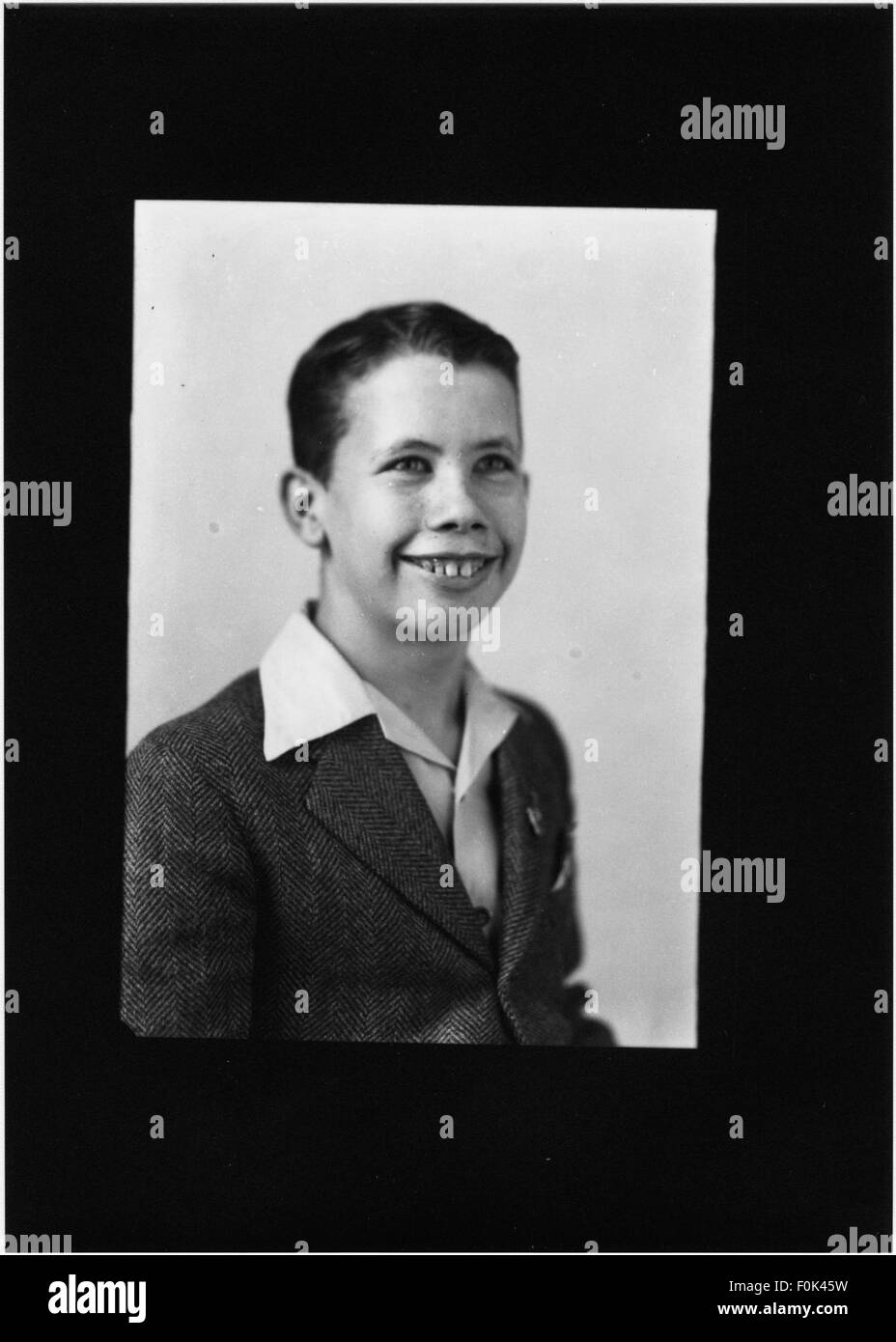 This photograph features an unidentified boy, capturing a moment in ...