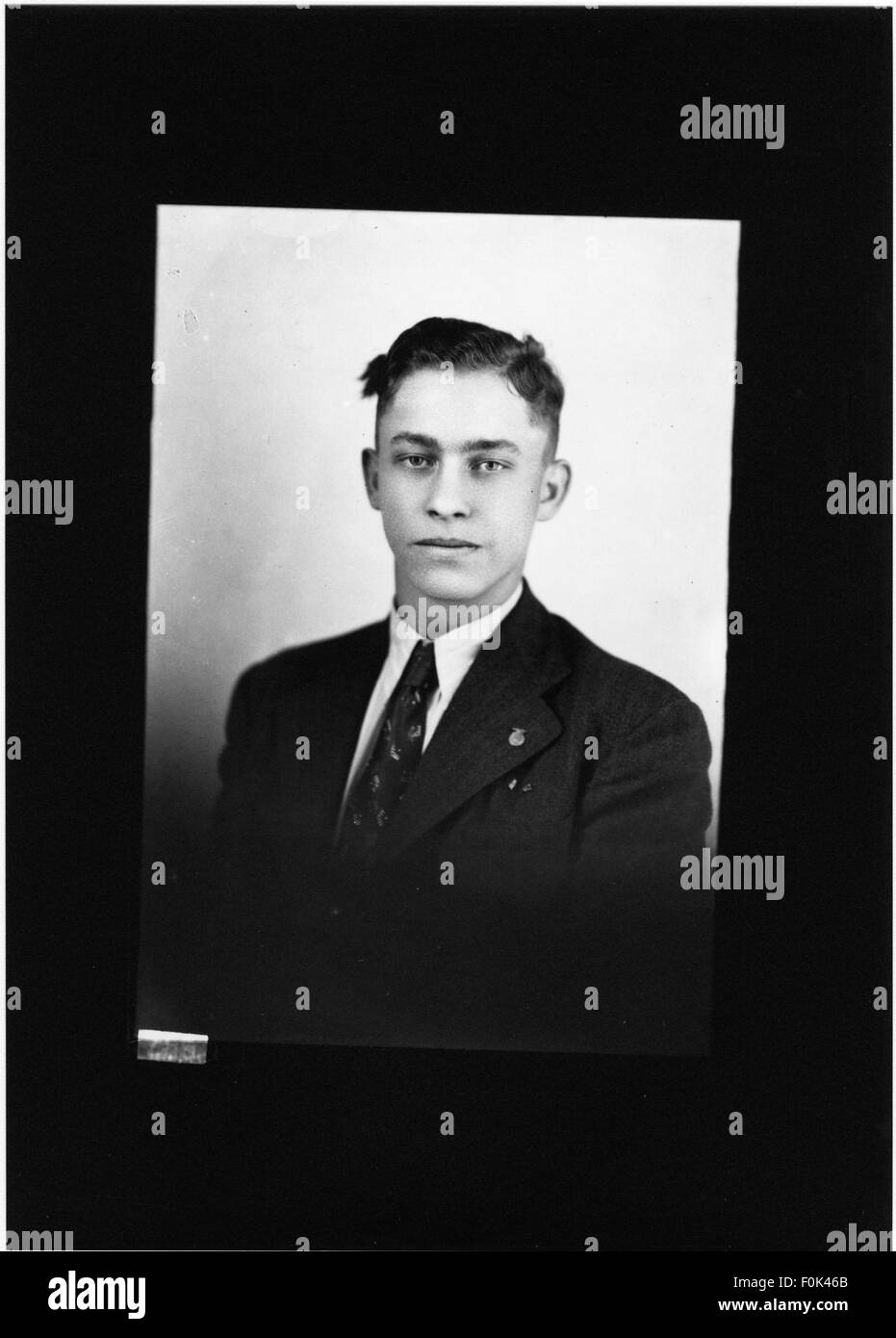 An unidentified man in an unknown setting, captured in a photograph ...