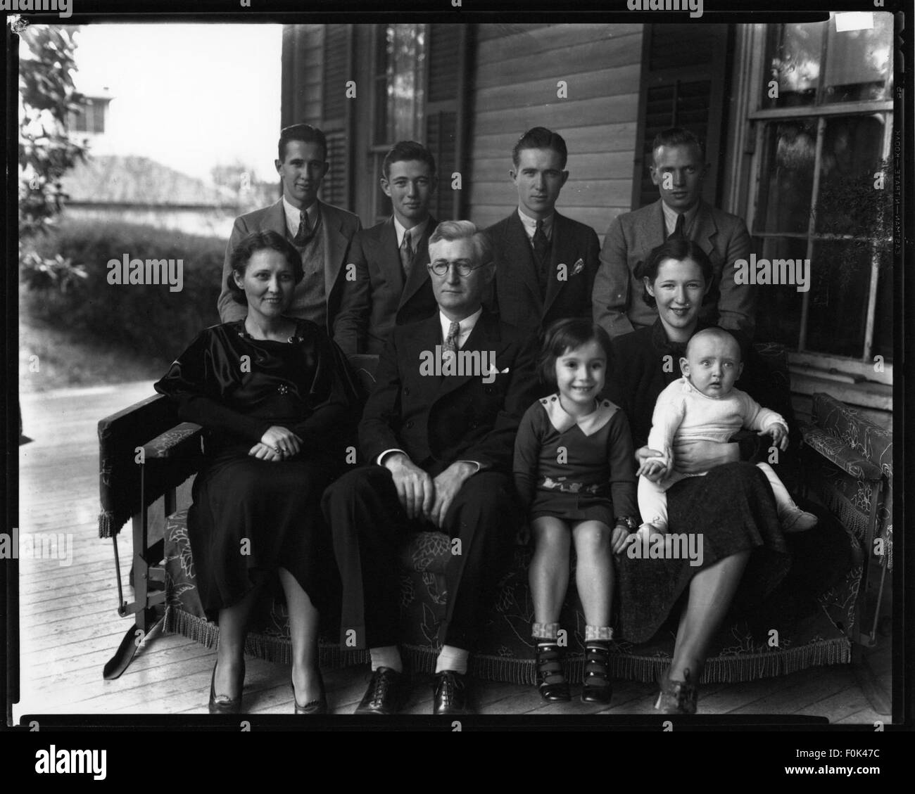 A group of unidentified men, women, and children are pictured in an ...
