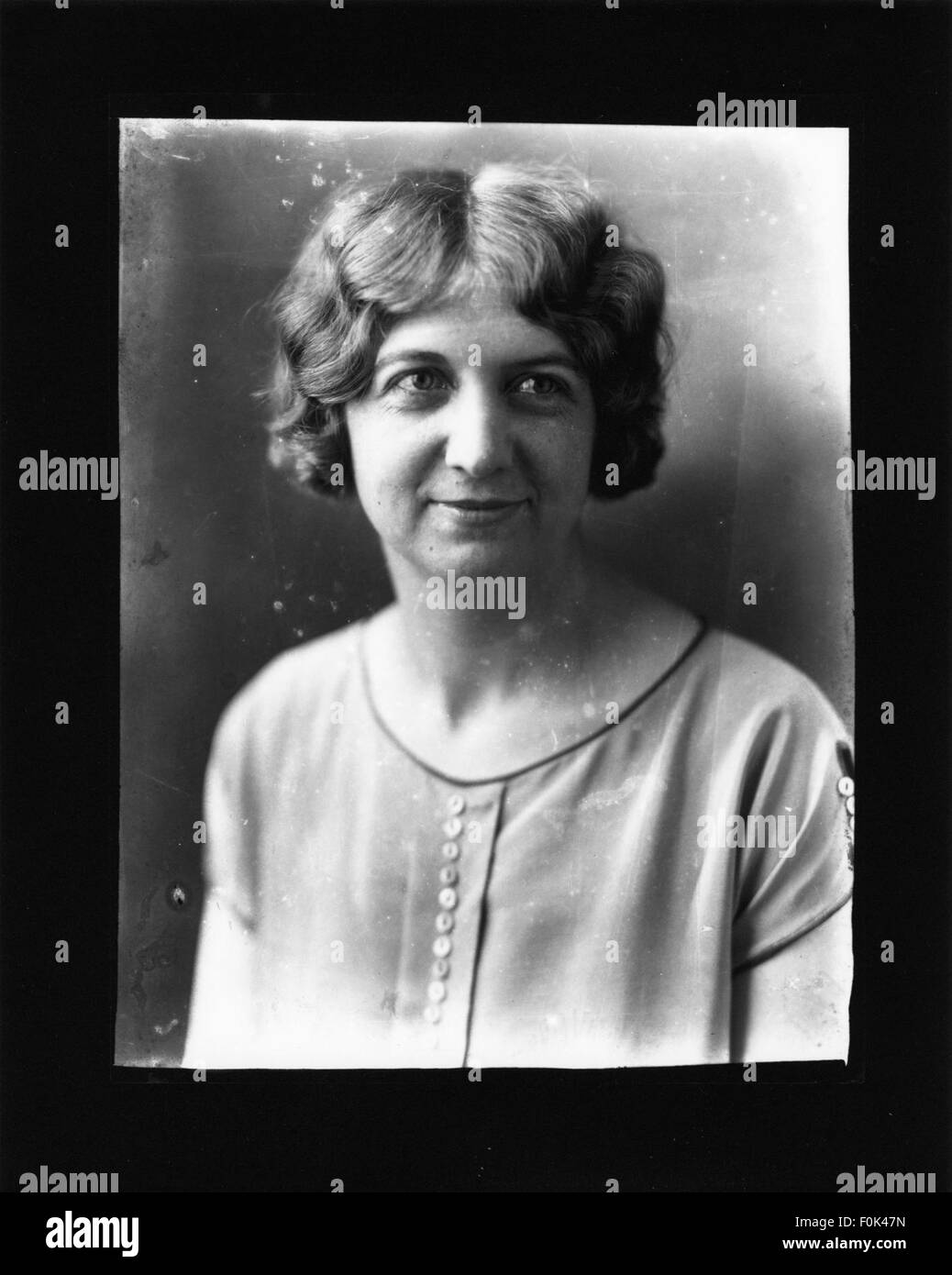 This photograph features an unidentified woman, capturing her in an ...