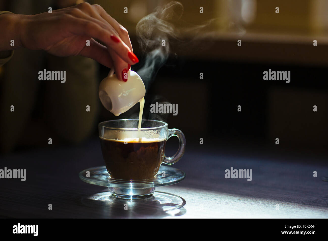 coffee with cream on table Stock Photo - Alamy