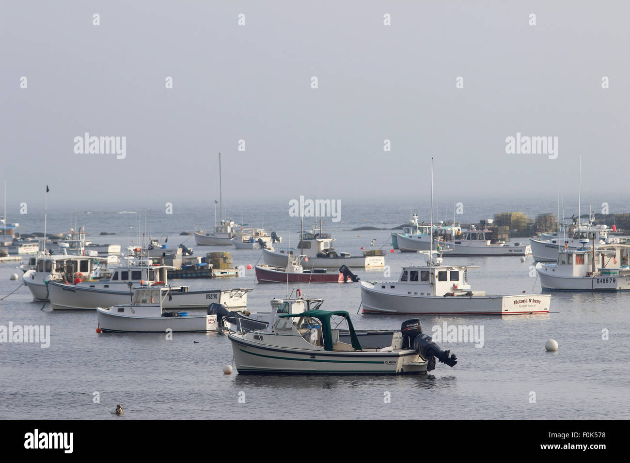 Lobster boats on moorings in harbor waterfront Vinalhaven Island Maine ...