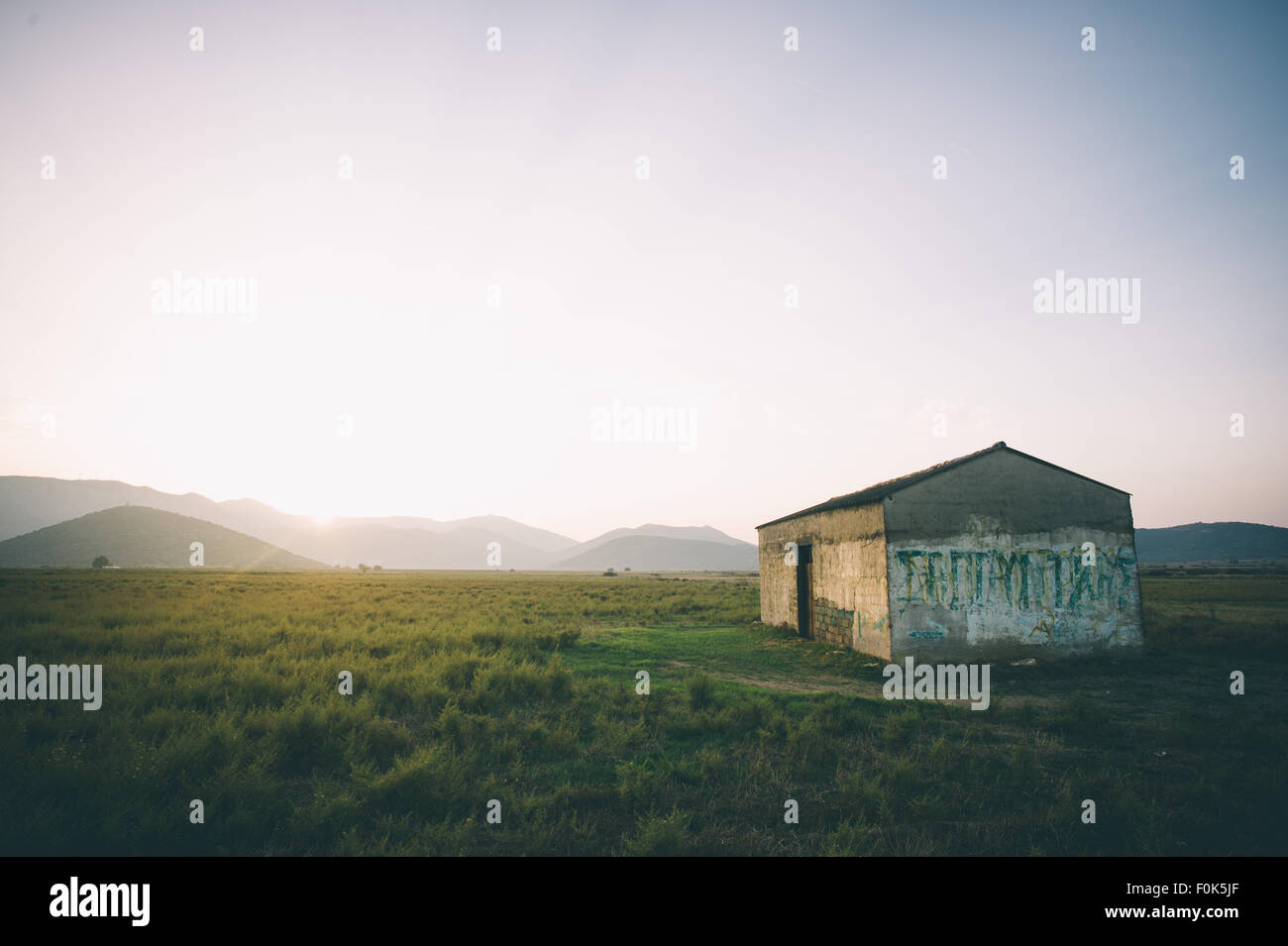 A lone hut at sunset Stock Photo - Alamy
