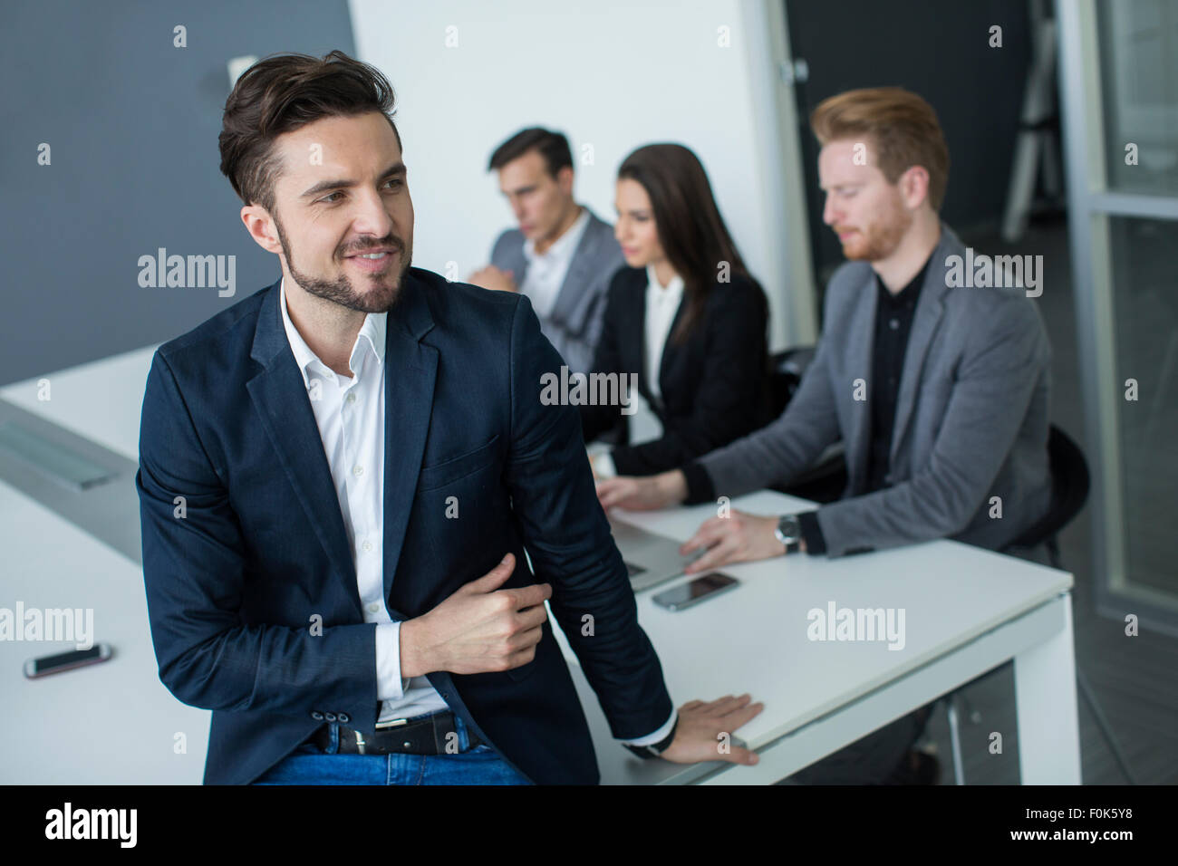 Young people in the office Stock Photo - Alamy