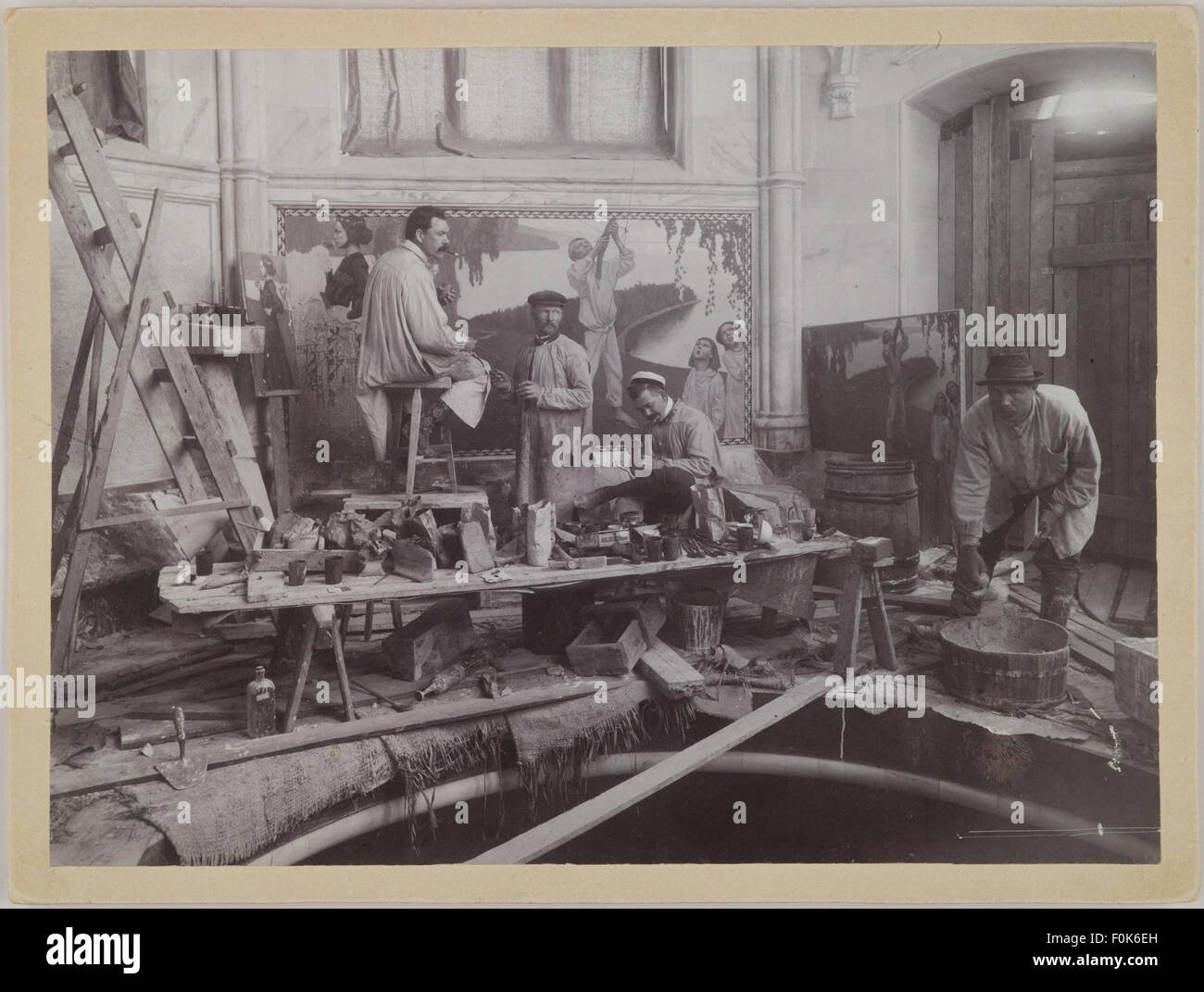 Axel Gallén, a renowned Finnish artist, works with his assistants on ...