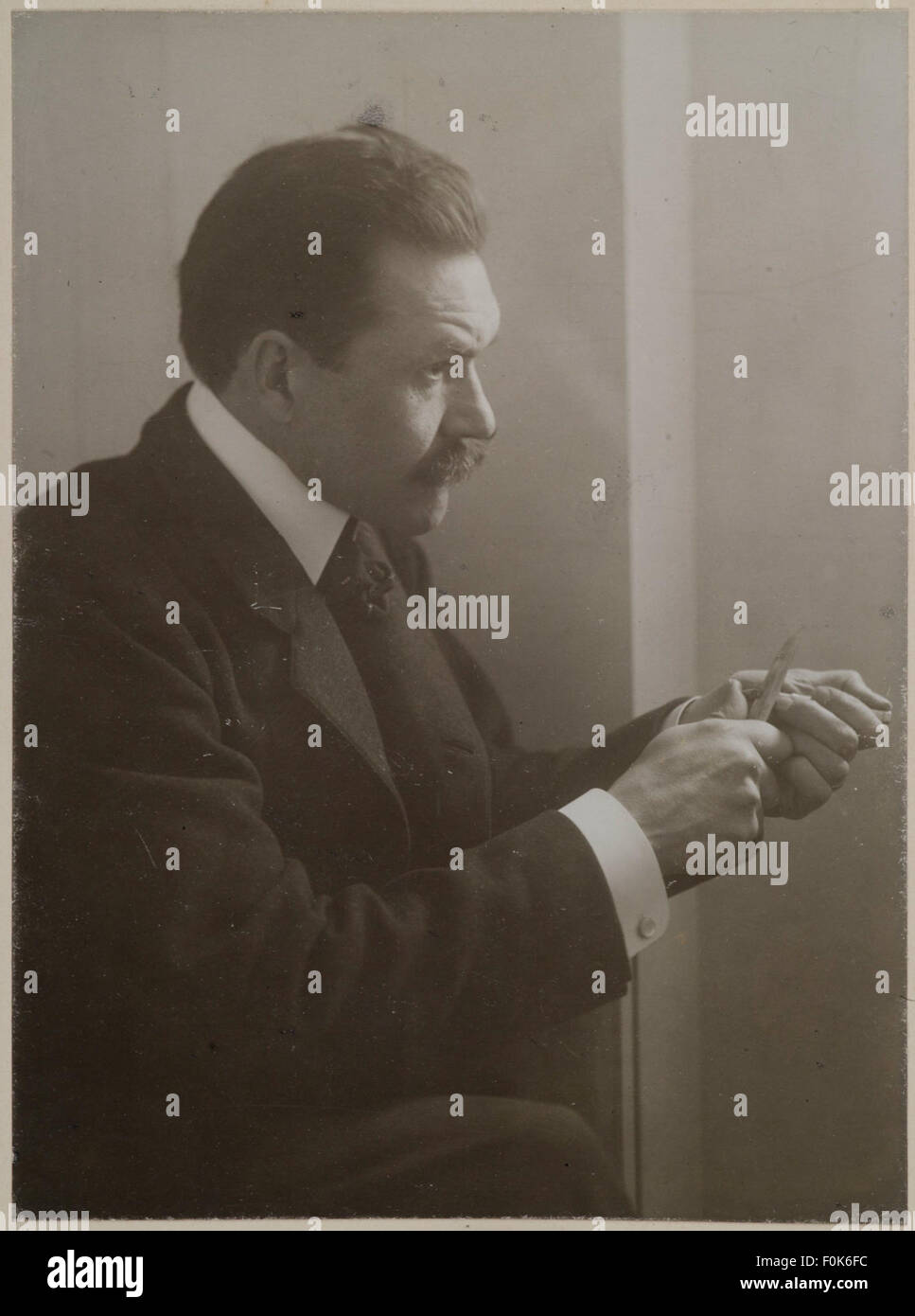 Finnish artist Axel Gallén is shown in Vienna around 1907, wearing a ...