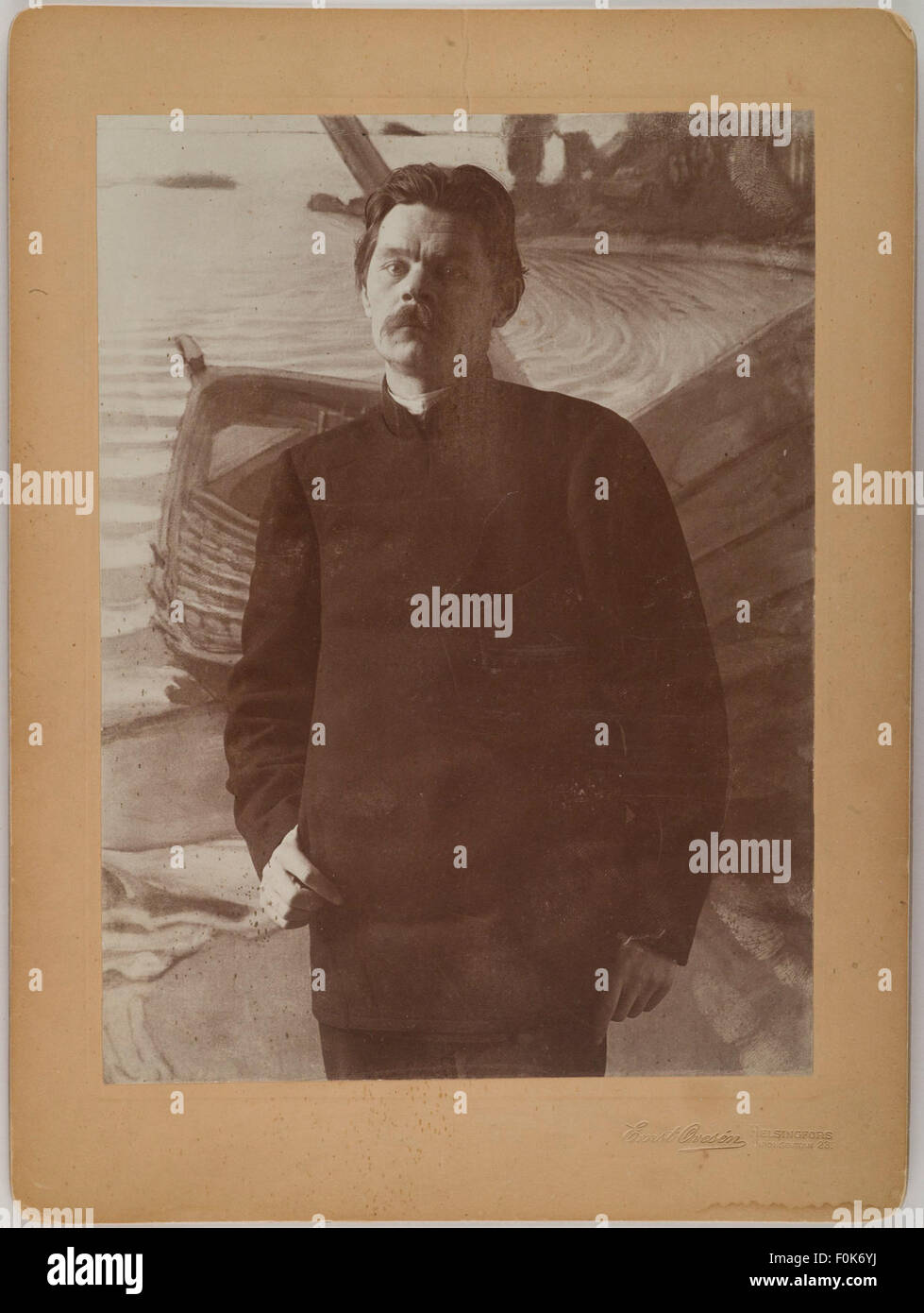 Russian writer Maxim Gorky is shown standing in front of the painting ...