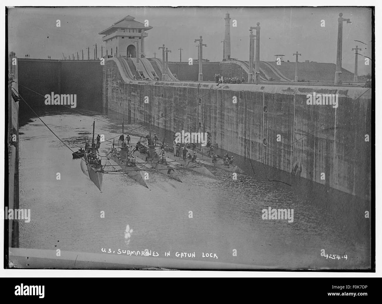This photograph captures U.S. submarines passing through the Gatun Lock ...