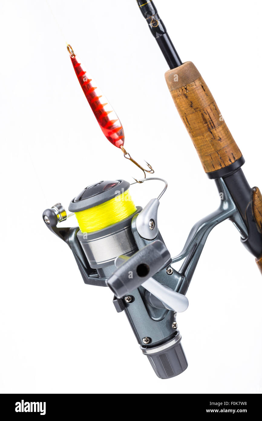 fishing rod and reel with line on white background Stock Photo - Alamy