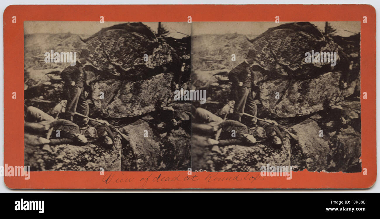 A historical image depicting the aftermath of a battle at Round Top ...