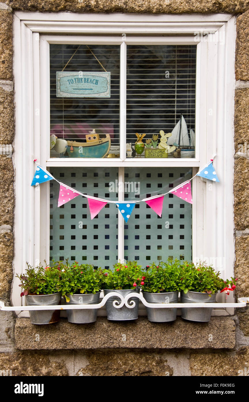 Vertical view of a decorative window in Mousehole, Cornwall Stock Photo ...