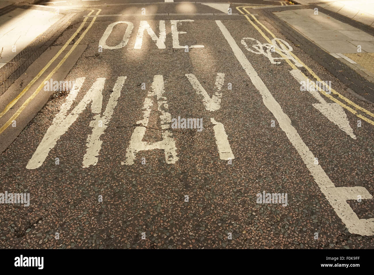 Road markings that say ONE WAY with a counterflow bike lane, London, UK ...