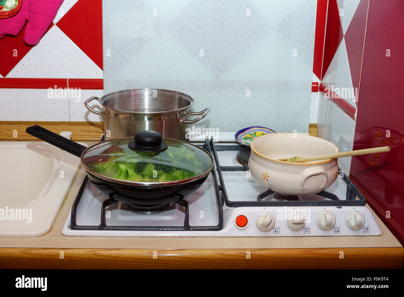 cooked broccoli, broccoli on fire in the kitchen Stock Photo - Alamy